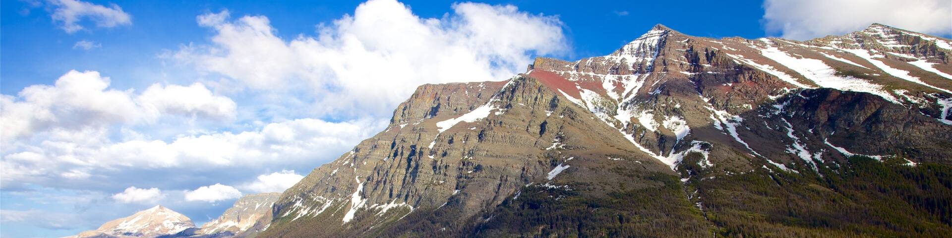 St. Mary Lake featuring mountains, a river or creek and tranquil scenes