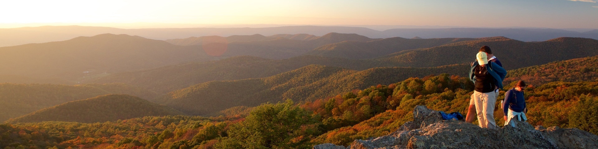 Bearfence Mountain which includes a sunset, landscape views and hiking or walking