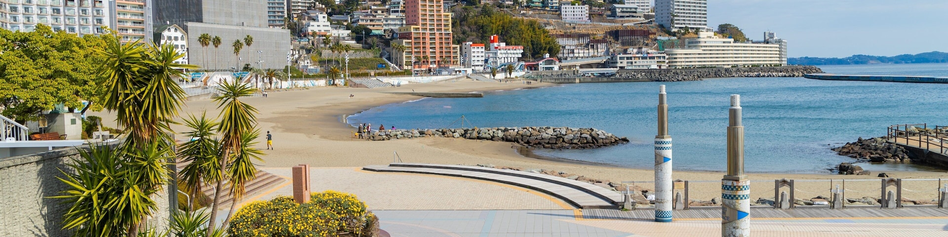 Atami Sun Beach showing a coastal town, general coastal views and a beach