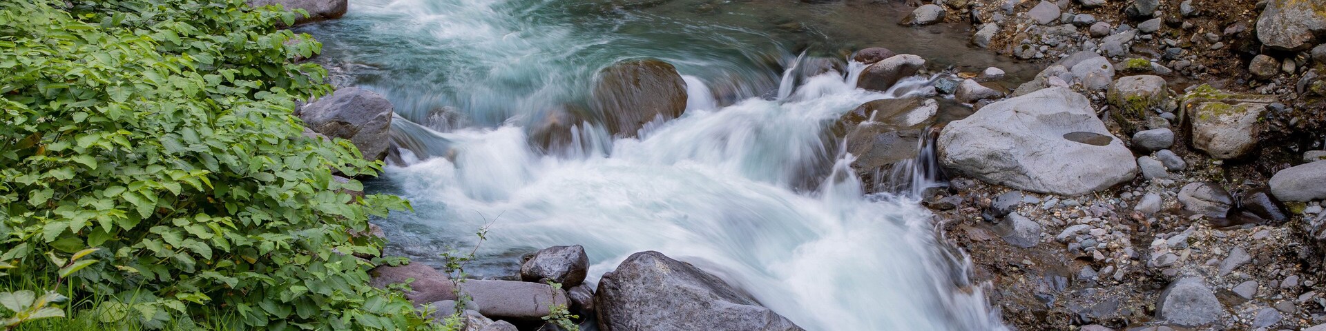 Higashikawa featuring a river or creek and rapids