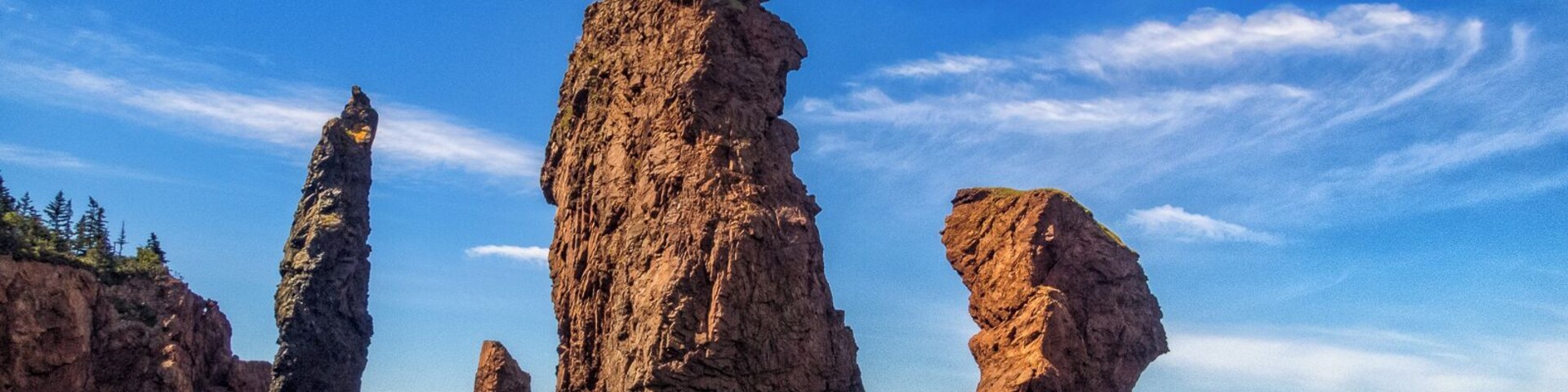 Nova Shores Adventures offers a fantastic 6-hour sea kayak tour in the Bay of Fundy around the Cape Chignecto coastline at high tide. A highlight was seeing the "Three Sisters" sea stacks, pictured here, up close. The tour offered by Nova Shores Adventures is suitable for beginners, taking you around at an easy pace that gives you opportunities to explore and learn about the geology and history of this region. There may be no better way to see this beautiful, wild stretch of coastline.