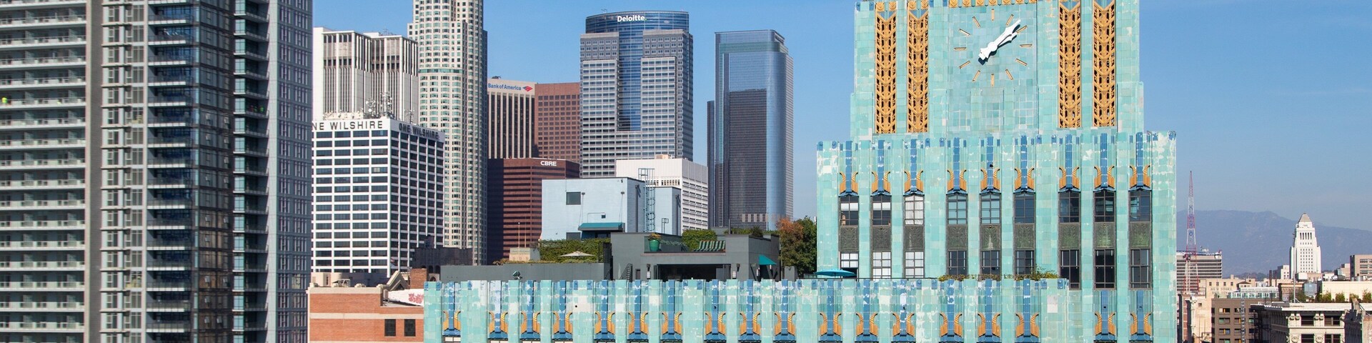 Eastern Columbia Building showing a high rise building, a city and signage