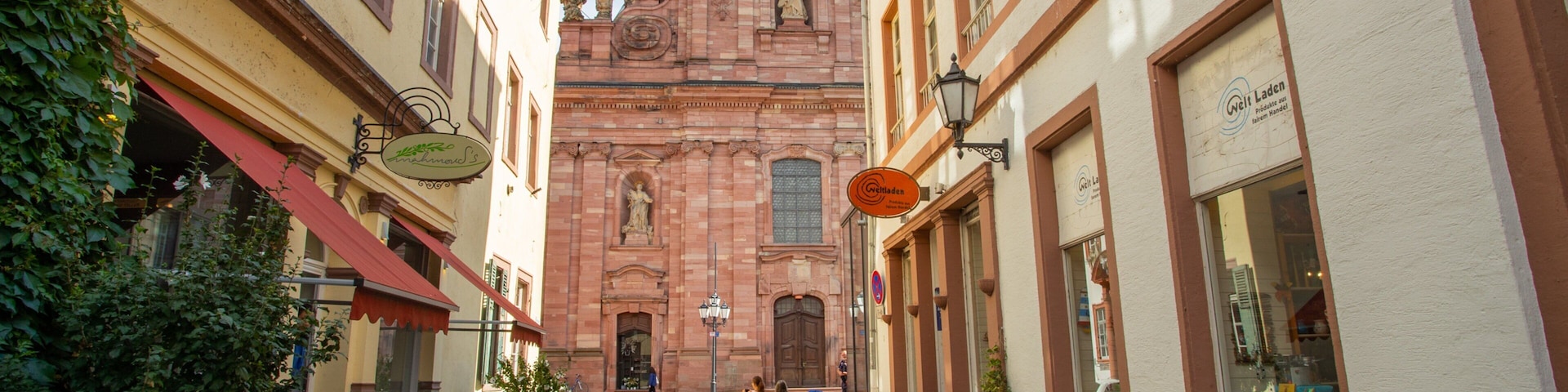 Jesuitenkirche which includes outdoor eating, heritage elements and a church or cathedral