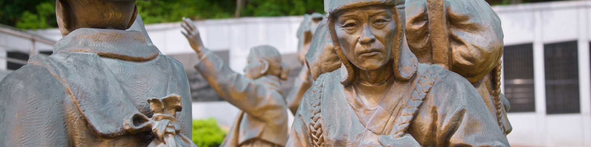 Geoje POW Camp featuring heritage elements and a statue or sculpture