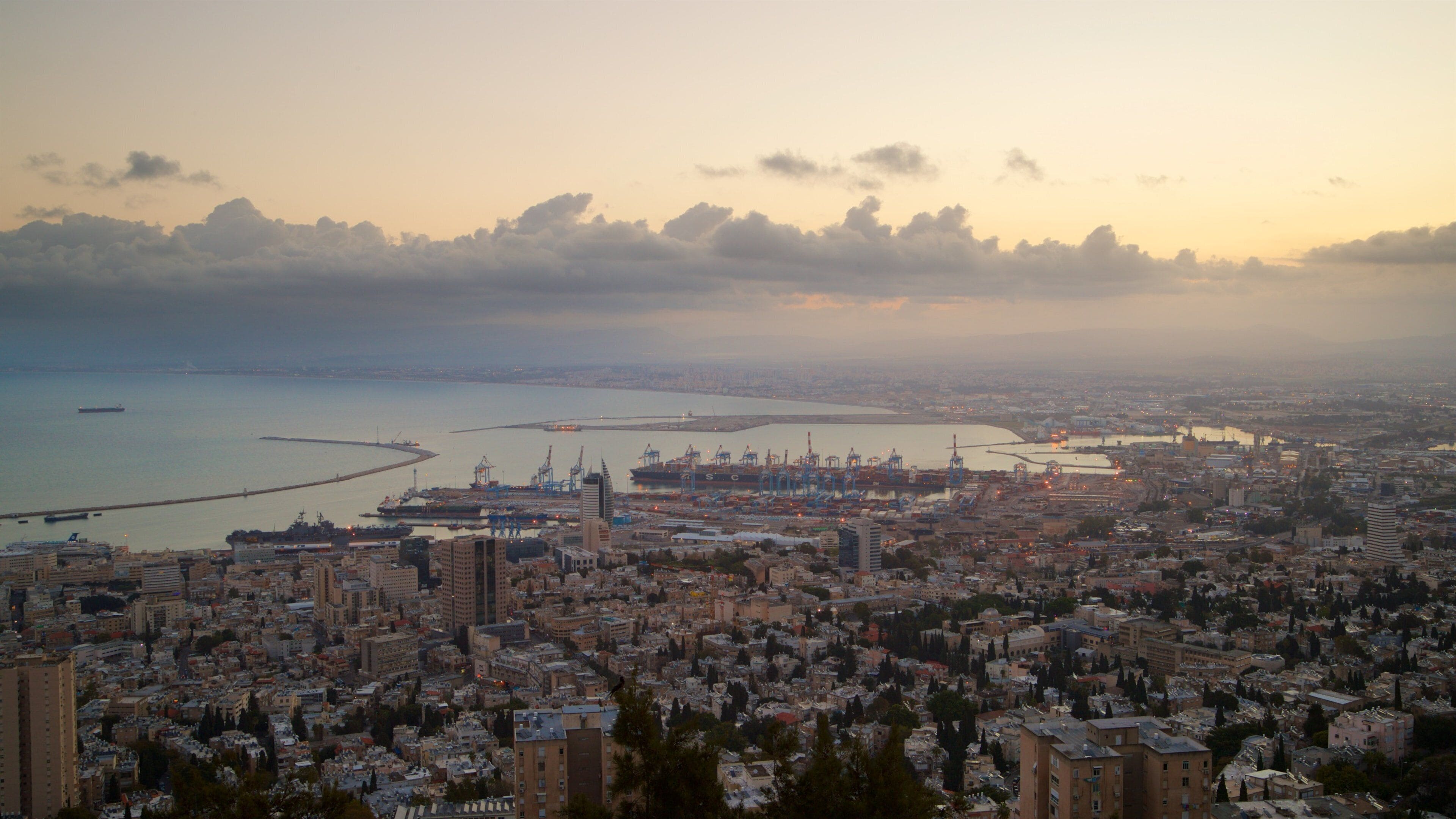 Haifa Port showing a sunset, a city and landscape views