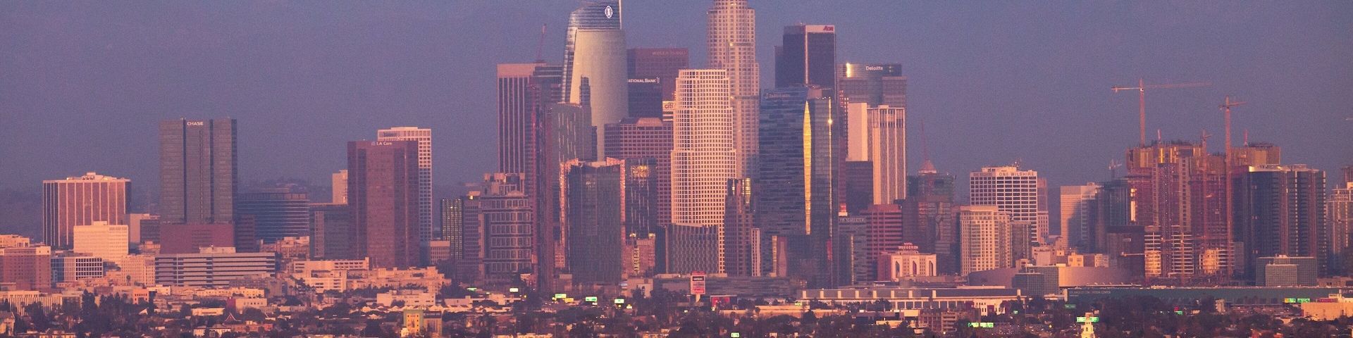 Kenneth Hahn State Recreation Area which includes a city, landscape views and a sunset