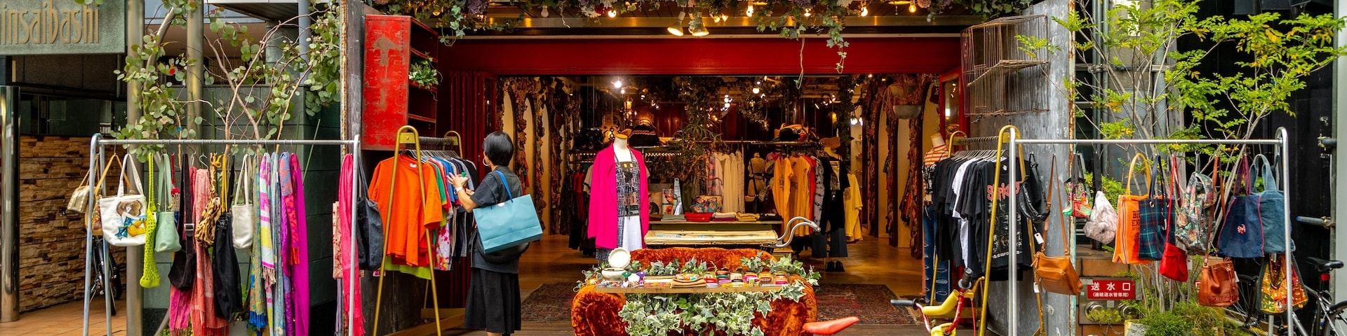 America Village featuring shopping as well as an individual femail