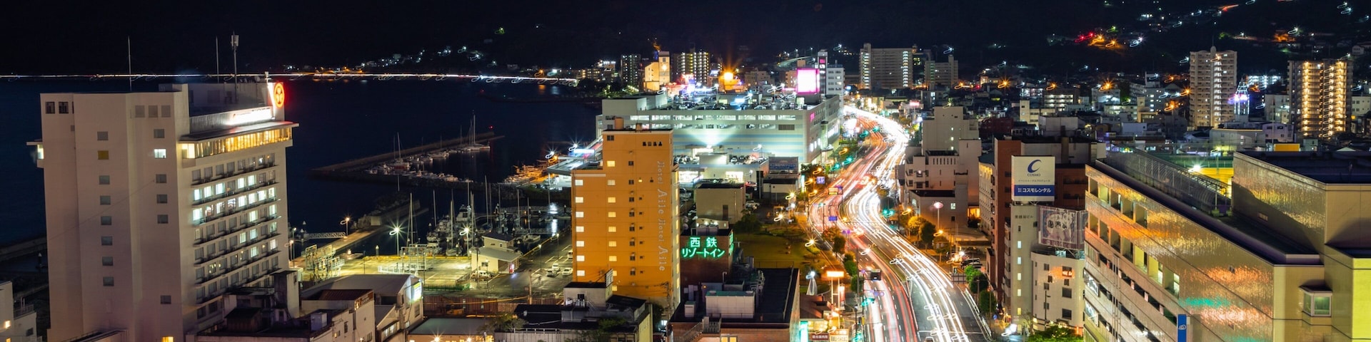 Beppu Tower which includes a city, night scenes and landscape views