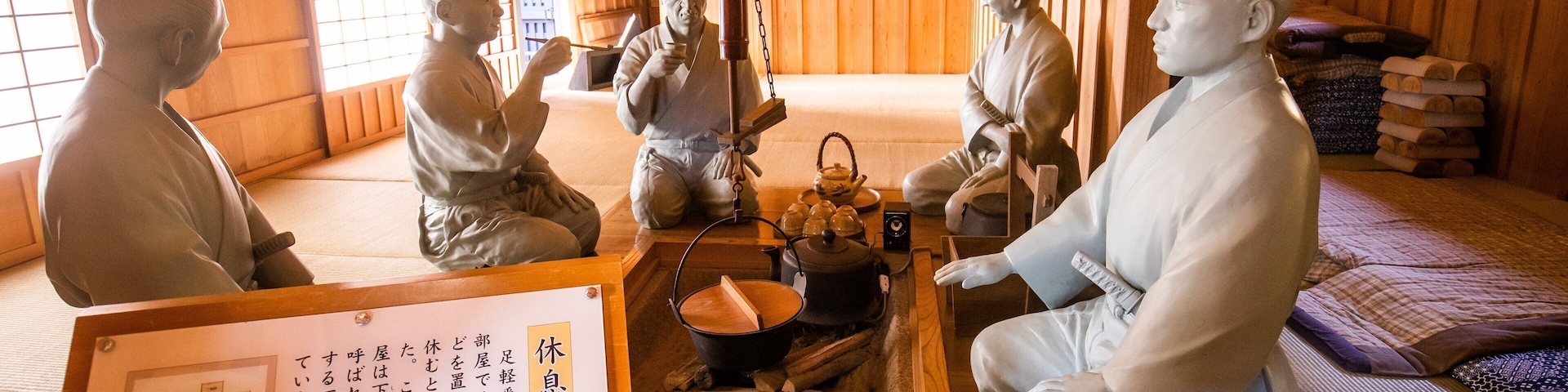 Hakone Checkpoint Museum featuring signage, a statue or sculpture and interior views