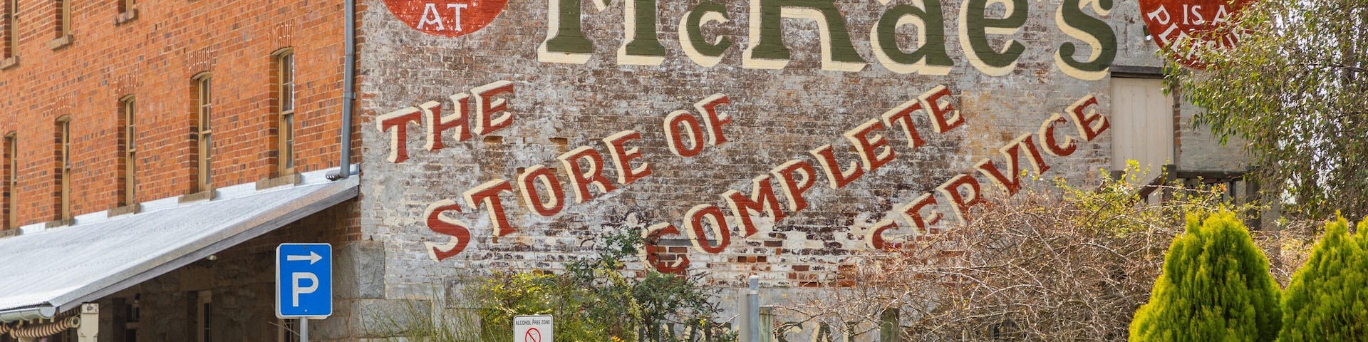 Mccrossin\'s Mill Museum featuring signage, a small town or village and heritage elements