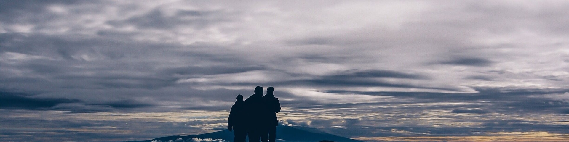 Trekking to 4565m high summit of Mount Meru in Tanzania. A hike through the beautiful national park of Arusha and meeting the african wildlife. One makes this trip unforgettable, a constant view on the wonderful Kilimanjaro. This early morning photo is taking just below the top of Mount Meru between two layers of clouds and only the peak of Kilimanjora on the Horizon. #nationalpark #africa #summit #meru #wilderness #travel #hiking #mountains