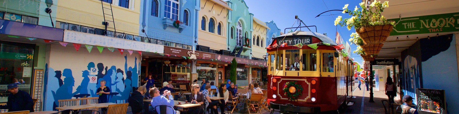 New Regent Street featuring railway items and outdoor eating as well as a small group of people