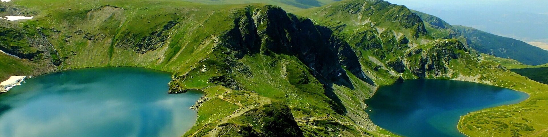These are two of the Seven Rila Lakes. Their names are: the Eye (Окото) on the left and the Kidney on the right (Бъбрека)