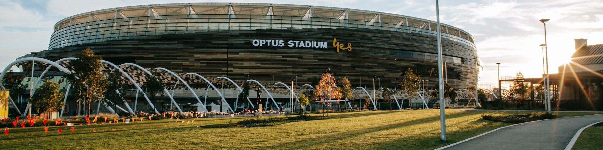 Optus Stadium featuring a sunset