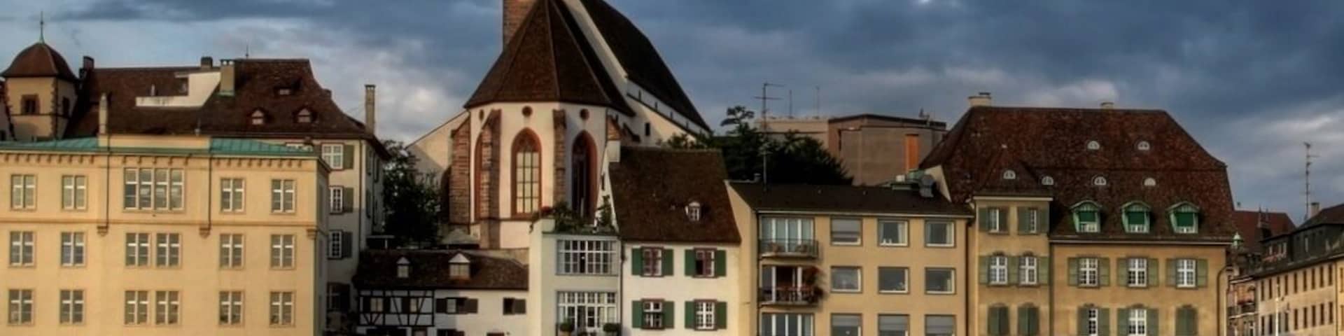 Basel is a city on the Rhine River in northwest Switzerland, close to the country’s borders with France and Germany. Its medieval old town centers around Marktplatz, dominated by the 16th-century, red-sandstone Town Hall. Its 12th-century Gothic cathedral has city views, and contains the tomb of the 16th-century Dutch scholar, Erasmus. The city’s university houses some of Erasmus’ works.