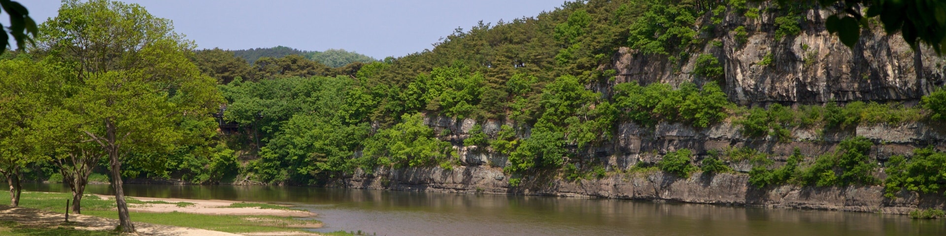 Buyongdae Cliff showing a river or creek and tranquil scenes