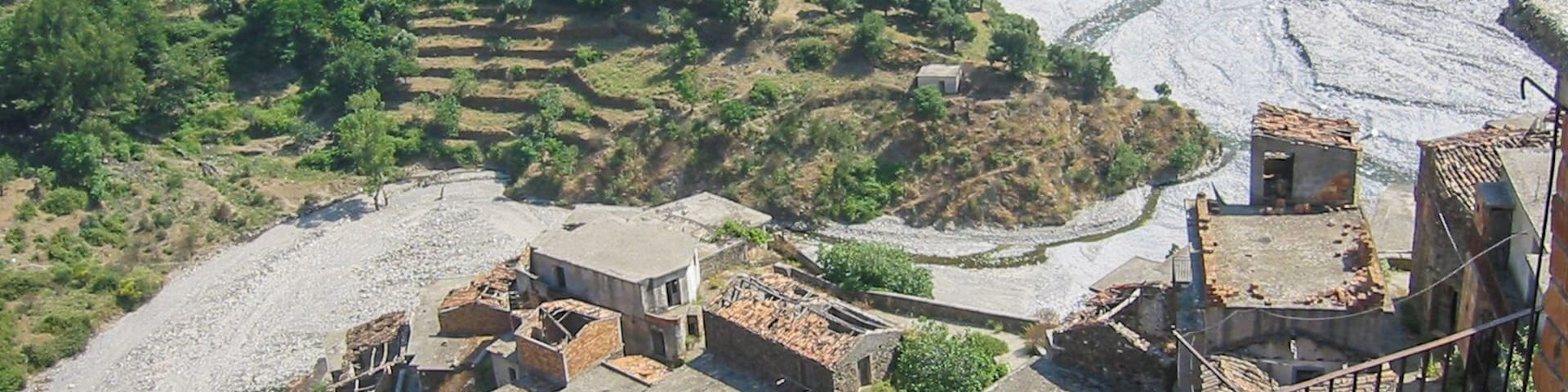 Village of Roghudi vecchio in Calabria, Italy, abandoned except for a man and his father, their dog and some goats.
