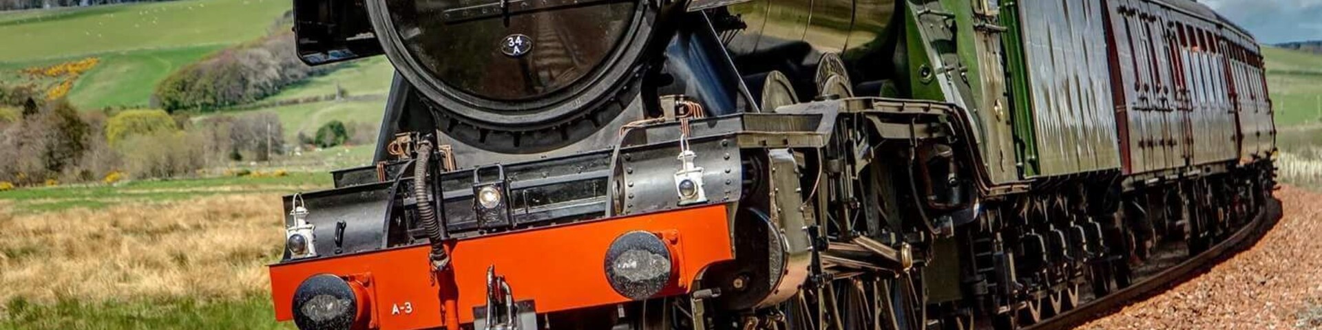 The Flying Scotsman, as it travels down through the Scottish Borders. Shot at a bend in the track, and staying safely on the right side of the safety fence