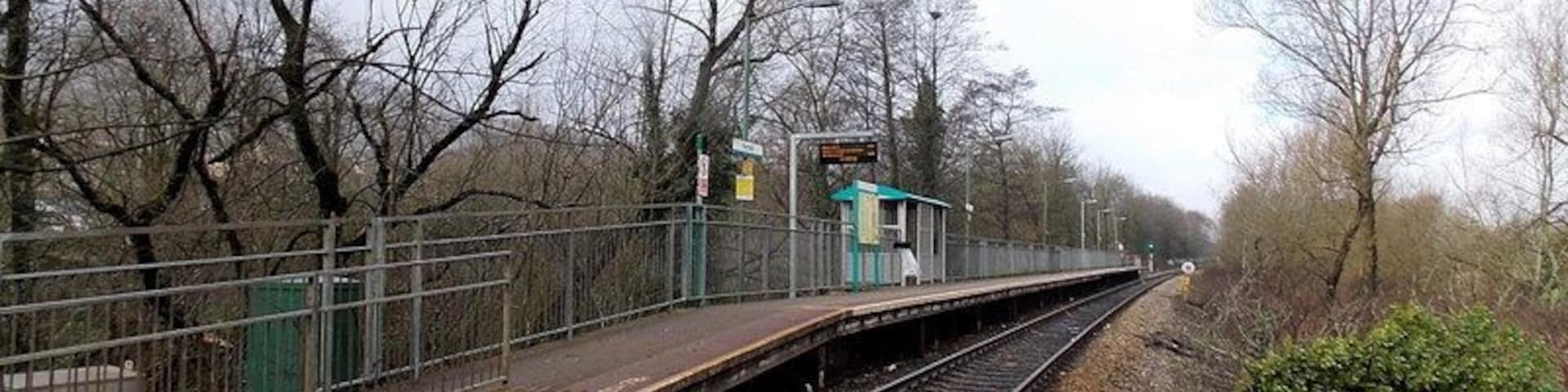 Fernhill railway station. Viewed from a level crossing. Fernhill is a single-track, single-platform station on the Aberdare Branch of the Merthyr Line, between Mountain Ash station and Cwmbach station.