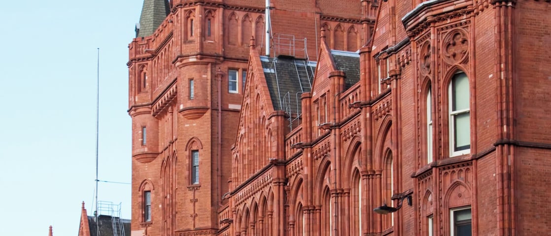 Gothic Revival style office block. Built 1885-1901 in several phases, by Alfred Waterhouse assisted by his son Paul.