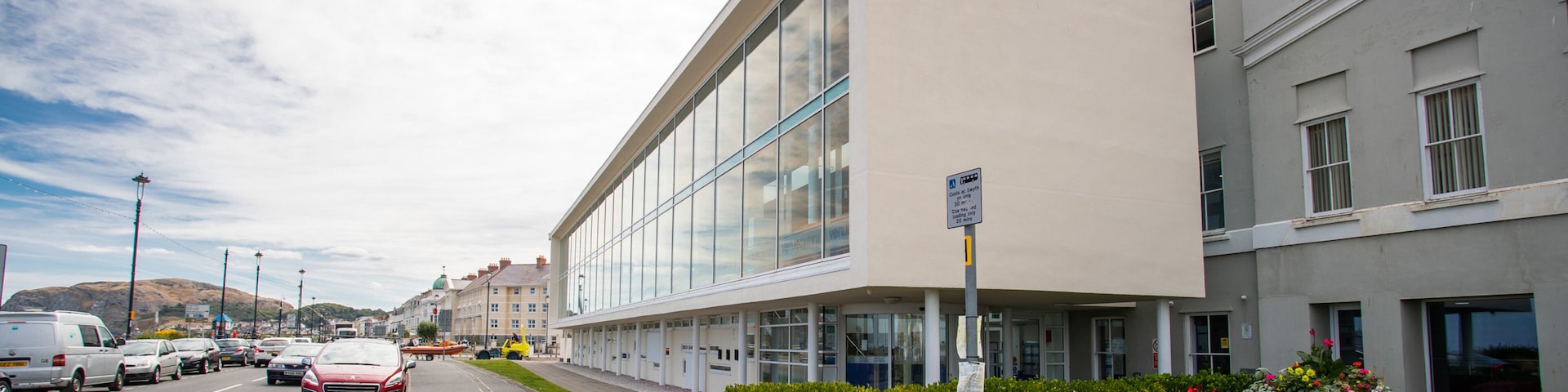 Venue Cymru featuring flowers, a park and signage