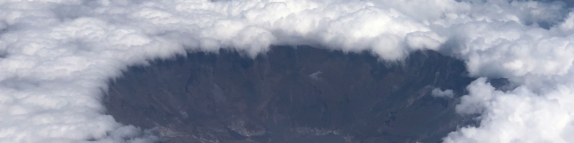 Clear of clouds in the middle at Mt Rinjani; taken from the flight to Labuan Bajo from Surabaya. The the right window seat (facing the cockpit) to have this view.