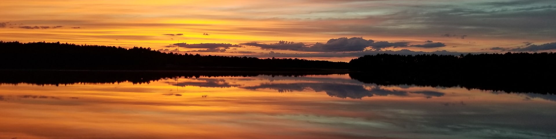 Sunset over Lake Dexter. Hot on one side, cool on the other.