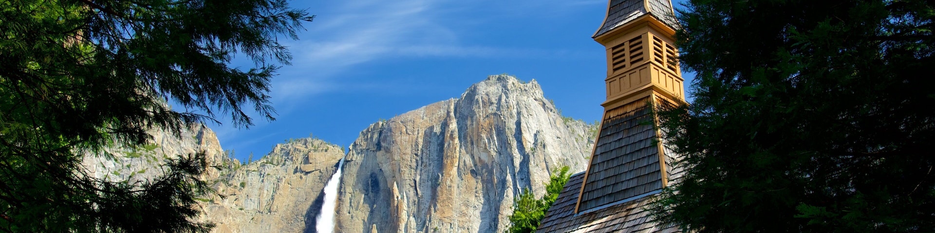 Yosemite Valley Chapel showing a cascade and heritage elements