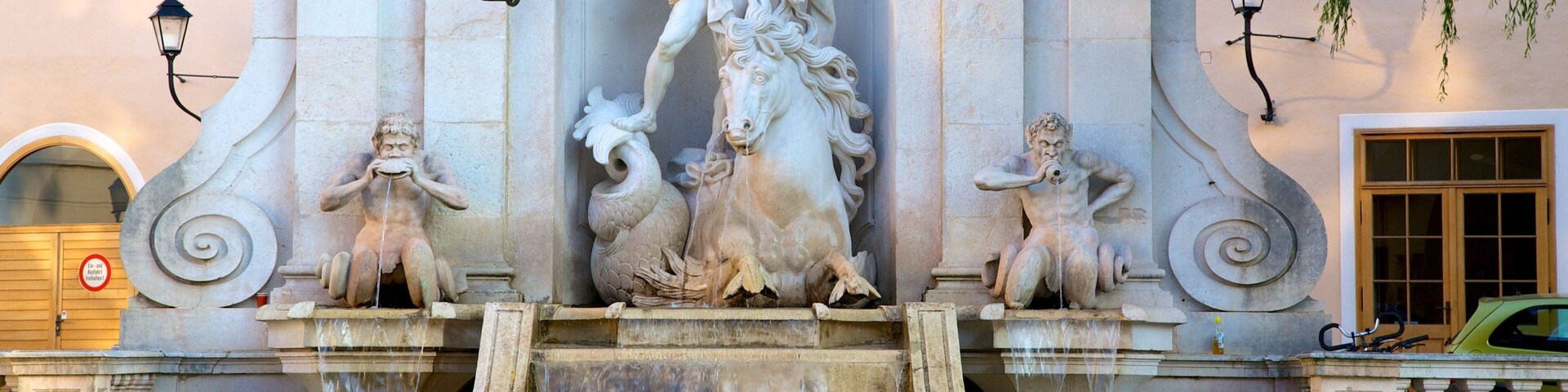 Salzburgo que inclui arquitetura de patrimônio, uma estátua ou escultura e uma fonte