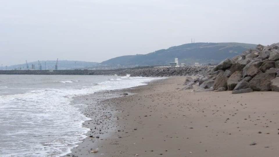 Jersey Marine Beach Swansea Docks and Sewage Works in the background.