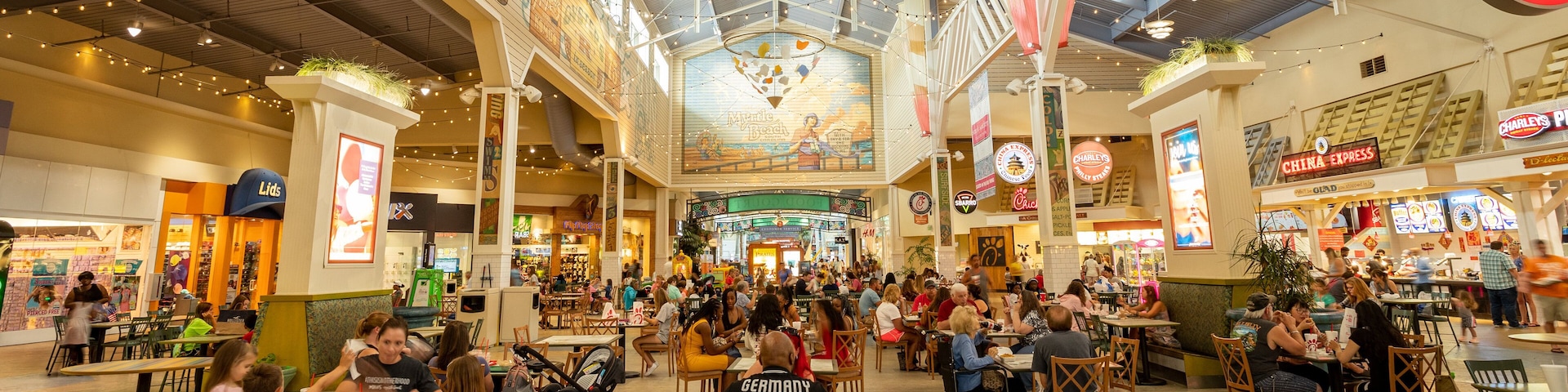 Coastal Grand Mall featuring shopping and interior views as well as a large group of people