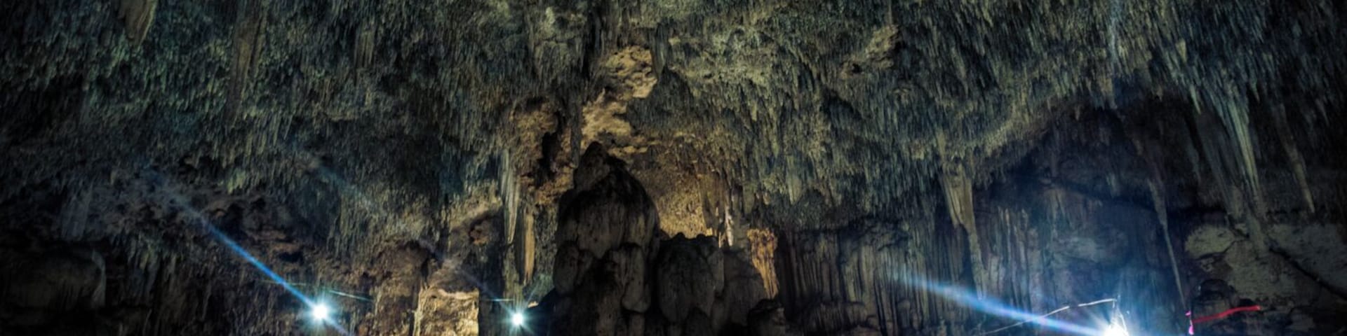 Just one look inside the Choj Ha cenote was all I needed to place it in the No. 1 spot in my list of All-Time Favorite Cenotes.
A massive cave full of columns, stalactites and stalagmites, with a beautiful area for swimming and another one for cave diving.
Even though it is located around 30 minutes away from Valladolid, it is a fairly unknown cenote managed by a small mayan community. 
Definitely worth the ride if you're looking for a really interesting place off the beaten path.