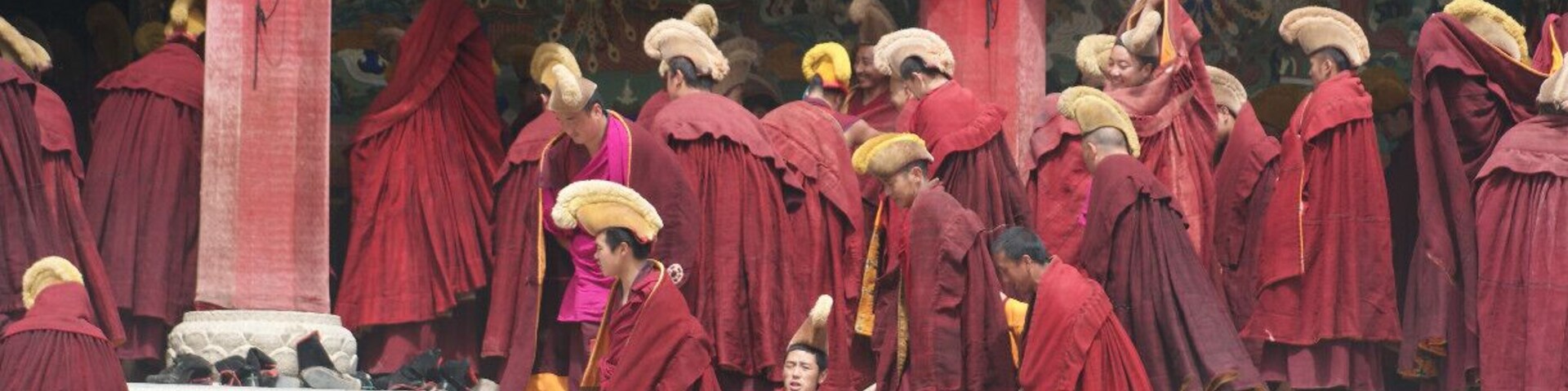 Monks entering the Main Temple. Labrang is the biggest lamasery of the Yellow Hat Sect outside Tibet