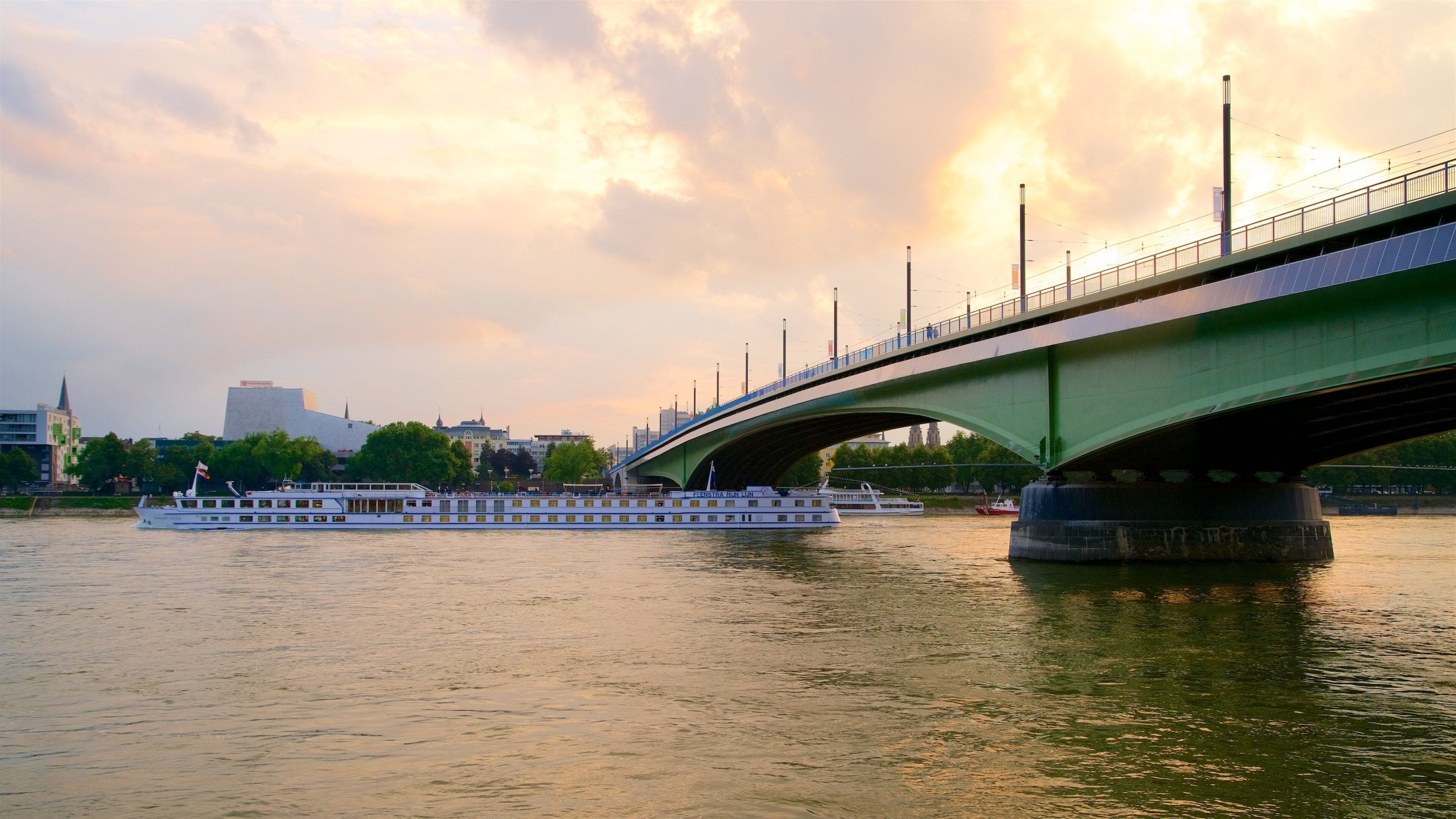 Kennedy Bridge which includes a bridge, a river or creek and a sunset