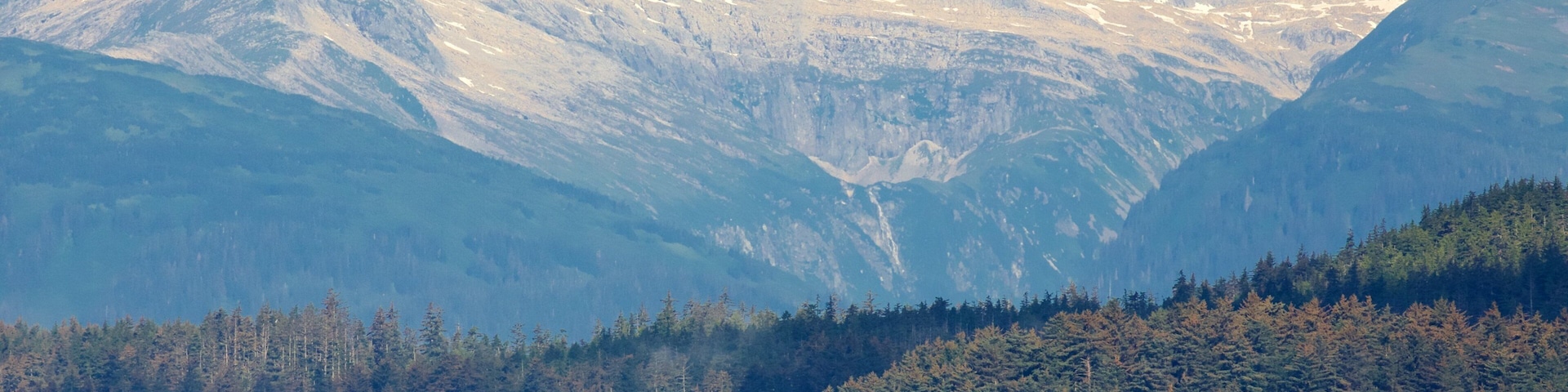 Auke Bay which includes landscape views, mountains and a lake or waterhole