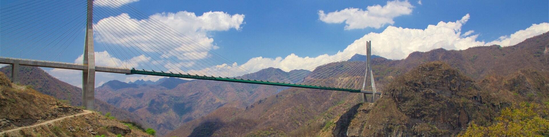 Mazatlan showing a gorge or canyon and a bridge