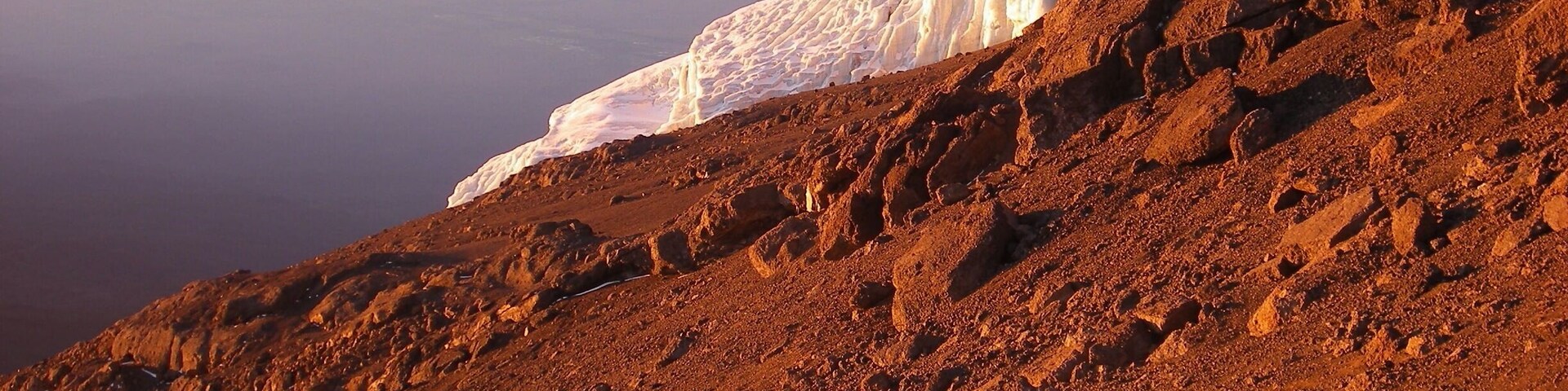 Descending while sun rises after reaching the top of Africa's highest peak, Mt. Kilimanjaro! (5895m)