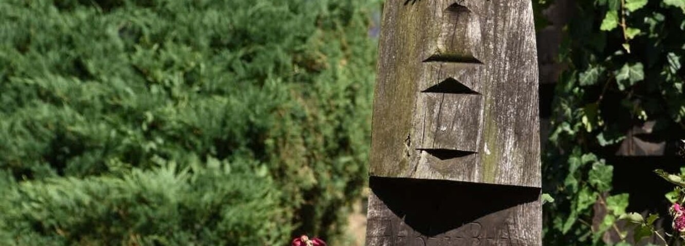 The unique cemetery of SzatmĂĄrcseke with over 600 boat-shaped wooden headstones. It's a functioning cemetery with several recent graves.