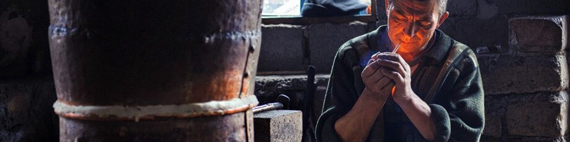 While on assignment for WWF-Romania, we visited some villages in the north of Romania, in Maramures. This man was making palinca (an extremely hot fruit brandy). While he was explaining the process, he decided all that talk deserved a cigarette.
www.doruoprisan.com