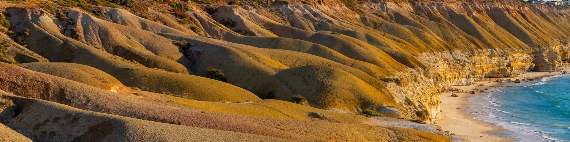 Port Willunga Beach featuring a coastal town, rugged coastline and general coastal views