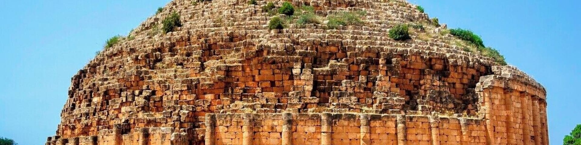 This lost pyramid in northern Africa is the burial tomb of Numidian king Juba II and his wife, Cleopatra Selene II (daughter of Cleopatra of Egypt and Mark Antony). Due to its poor maintenance, it is currently on the list of endangered UNESCO World Heritage Sites.
Access to the site is off the highway between Algiers and the nearby Roman city of Tipaza.