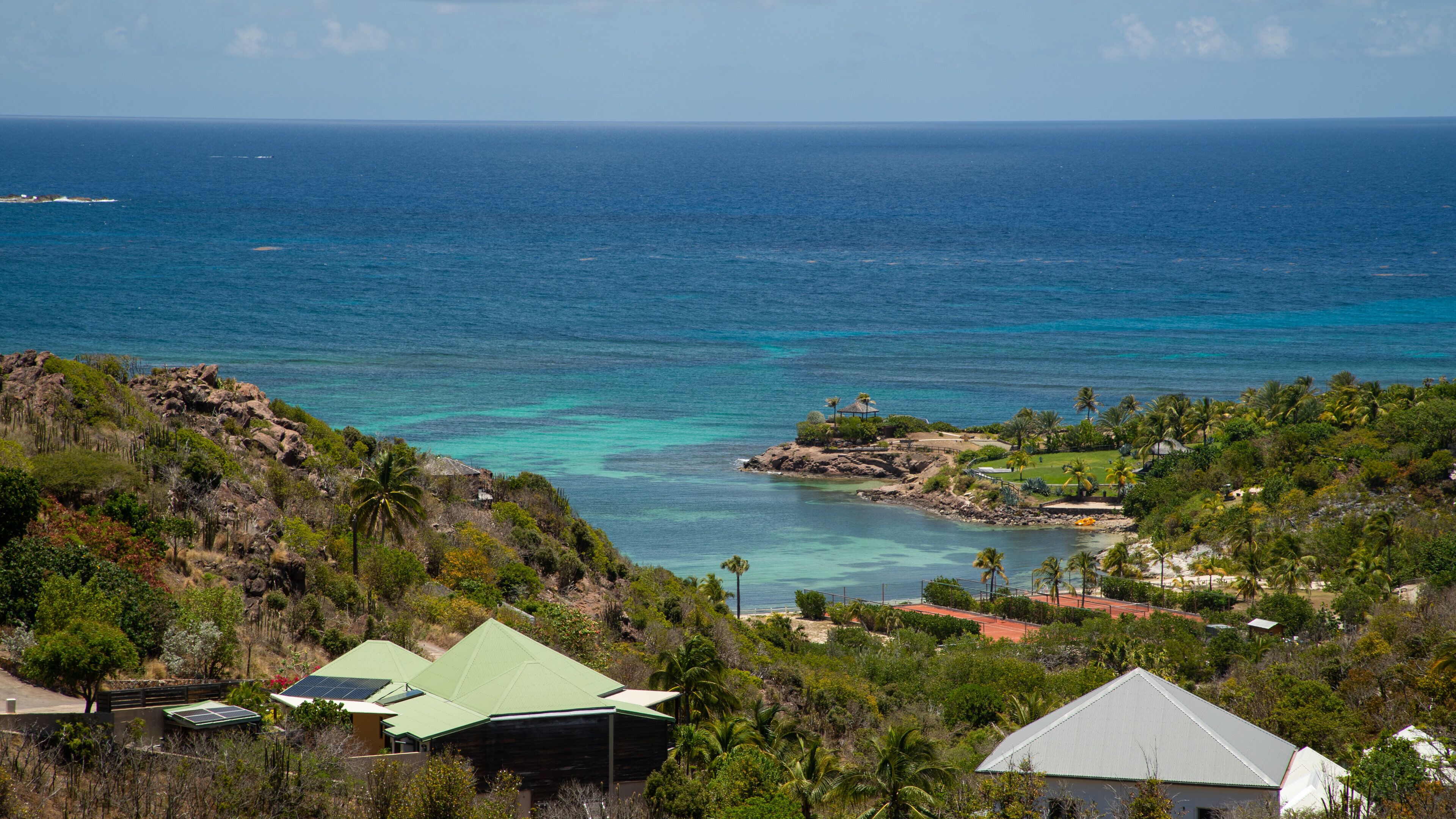 Grand Cul-de-Sac which includes landscape views, a coastal town and general coastal views