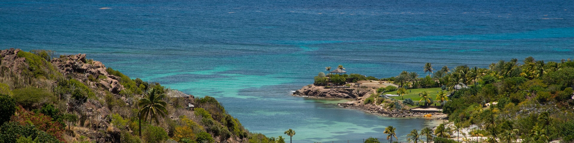 Grand Cul-de-Sac which includes landscape views, a coastal town and general coastal views