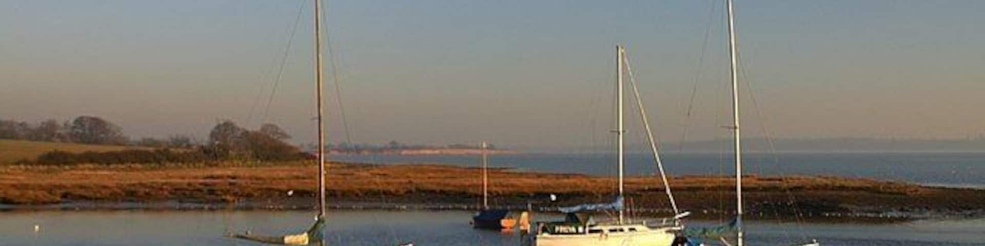 Evening Calm Looking east across the mouth of Holbrook Creek, and along the Suffolk bank of the River Stour