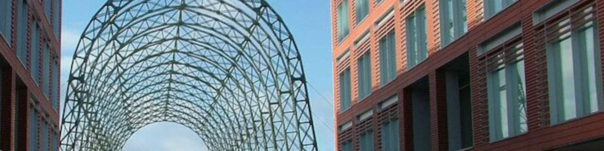 Historic temporary balloon shed frames Original frames for a temporary balloon shed from the very earliest days of flying have been erected as just a nice place for staff to rest or meet at Farnborough Business Park (part of Farnborough Airport.)