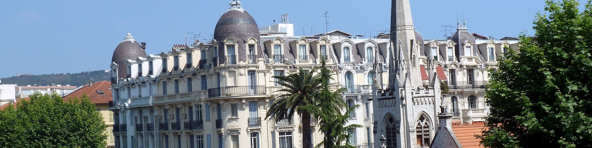 The spire of protestant church in Nice. In the background Hotel La Villa Victor Hugo, Boulevard Victor Hugo.