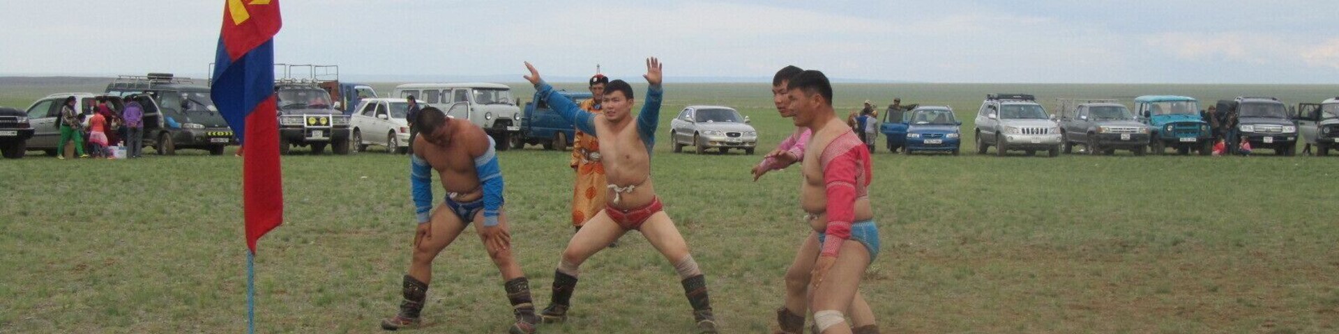 After a wrestling match the victors perform the eagle dance around the flag. We were lucky enough to go to a very small nadaam while we were in the Gobi Desert. The nadaam has wrestling, archery and a cross-country horse race. #Gobi Desert