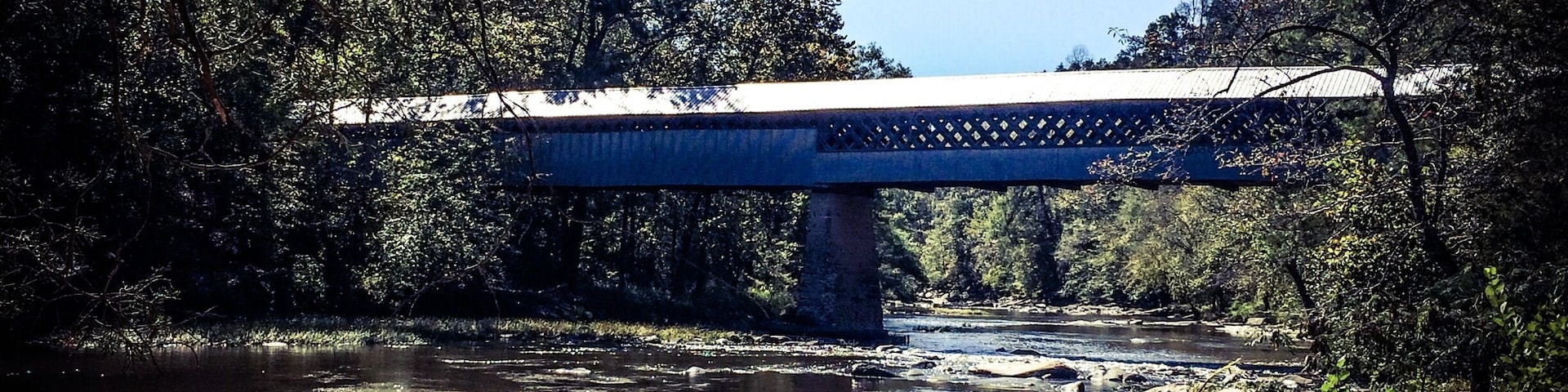 The longest existing covered bridge in Alabama located above the Black Warrior River with the most amazing view of the bluff. This bridge is still in use today and was constructed in 1933. One of three in Blount County.
