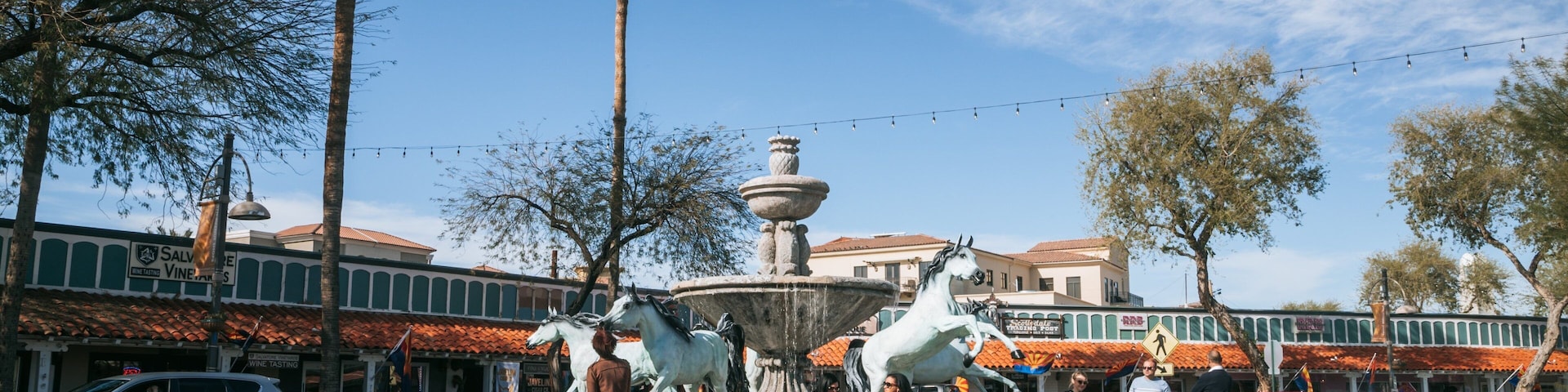 Downtown Scottsdale featuring a fountain, flowers and street scenes