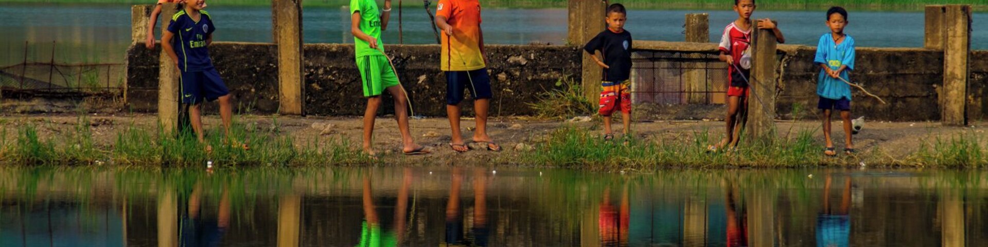 A group of boys fishing on a small pond in Xam Neua, where we explored some of the cave buildings that were used as shelter during the indiscriminated bombing of Laos--part of a secret fight by the USA during the Vietnam War.